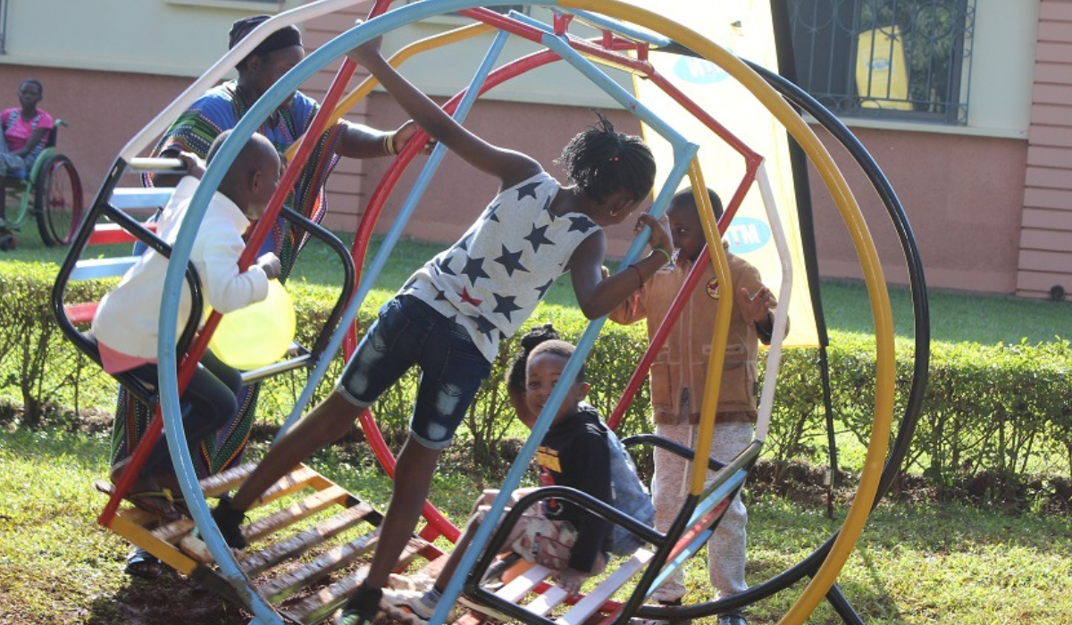 Playtime for children at CoRSU Hospital in Uganda | CBM UK